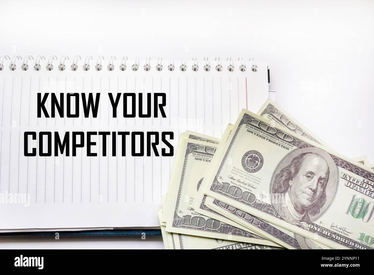 KNOW YOUR COMPETITORS the text is written on a notepad and a white ...
