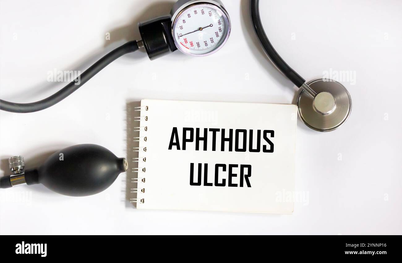 The Medical Term Aphthous Ulcer Is In A Notebook On A White