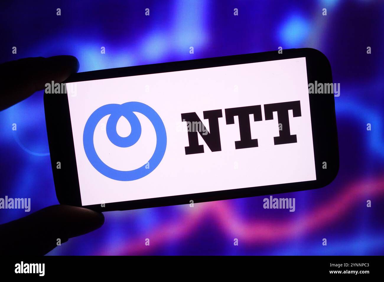 In this photo illustration, the NTT company logo is seen displayed on a ...