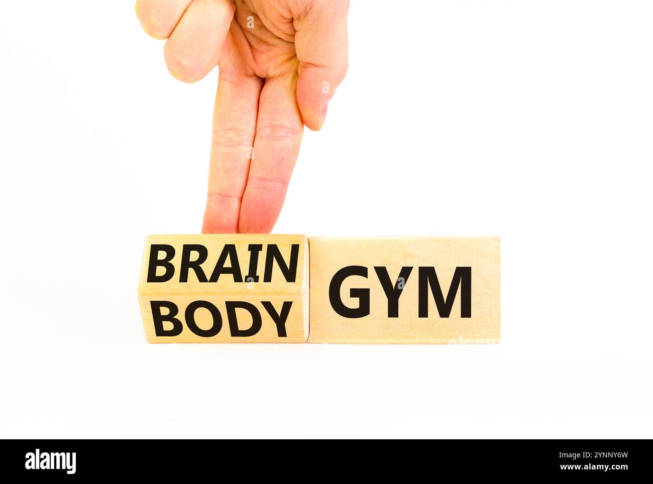 Body vs brain gym symbol. Businessman turns wooden cubes and changes ...