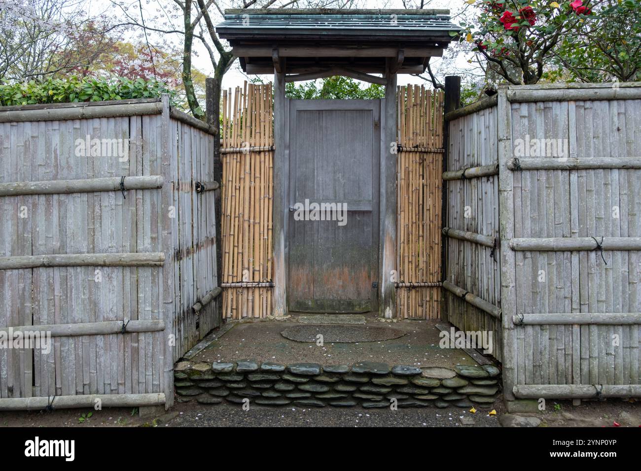 Traditional Japanese garden gate, a wooden door with a small roof ...