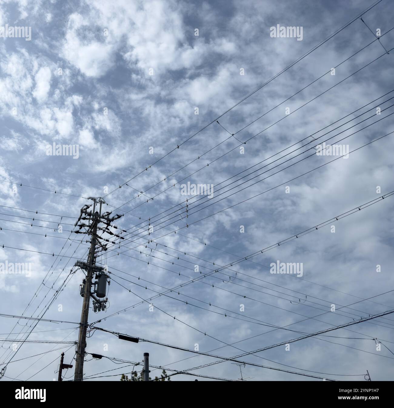 Electricity pole in Japan with electric power line cables, cloudy sky ...