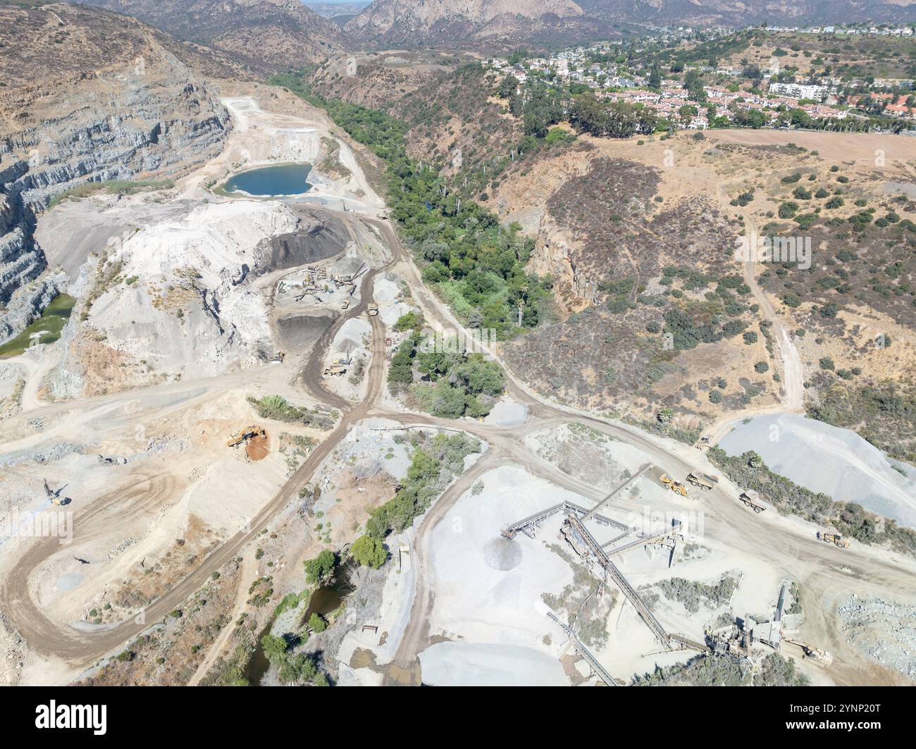 Aerial view of industrial sand and gravel quarry open-pit mining site ...