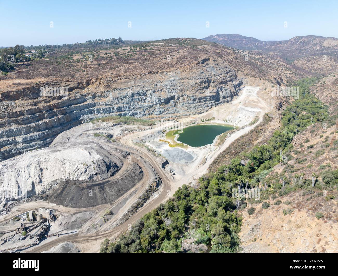 Aerial view of industrial sand and gravel quarry open-pit mining site ...