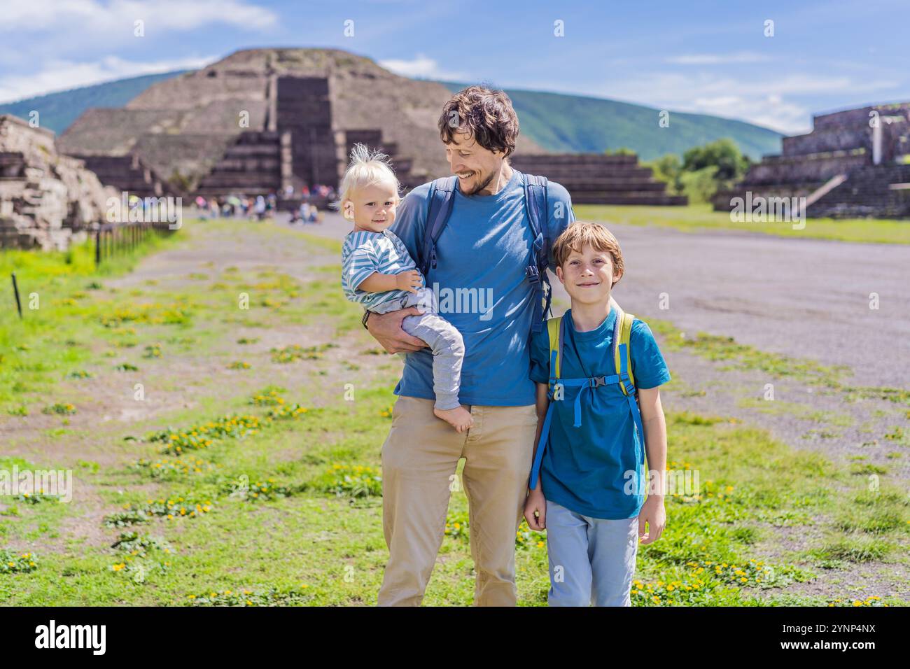 Father with his toddler and teenage sons exploring Teotihuacan, Mexico ...