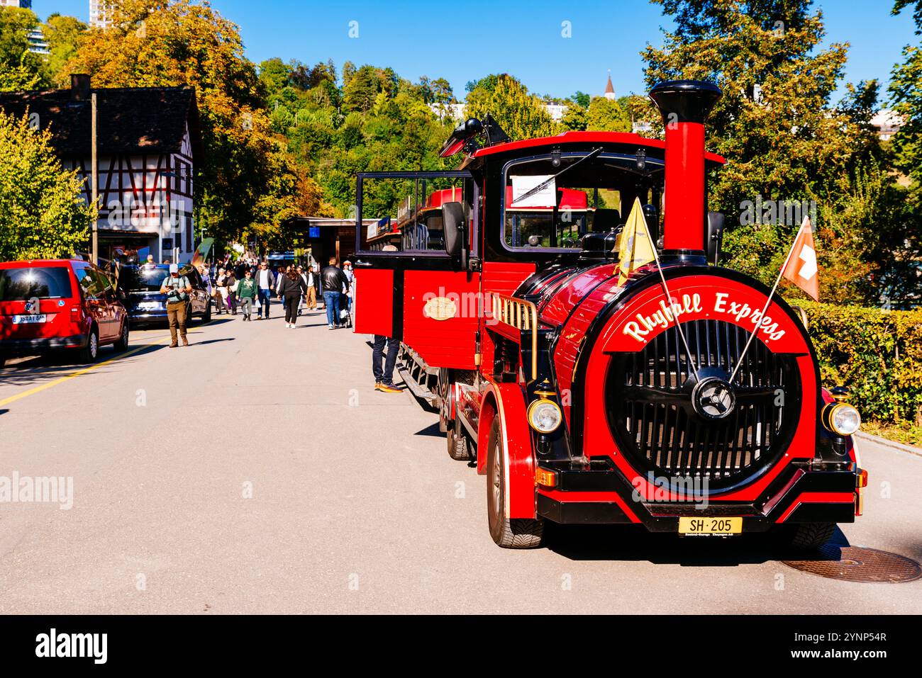 Small tourist train on the promenade. Rhine Falls is a waterfall ...