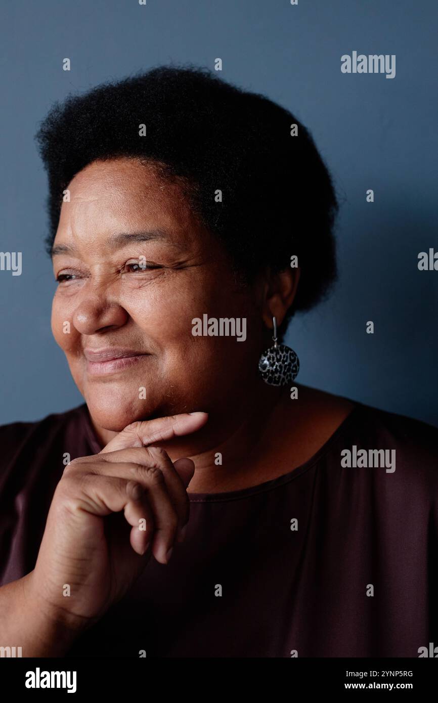 Minimal closeup portrait of African American senior woman smiling with ...