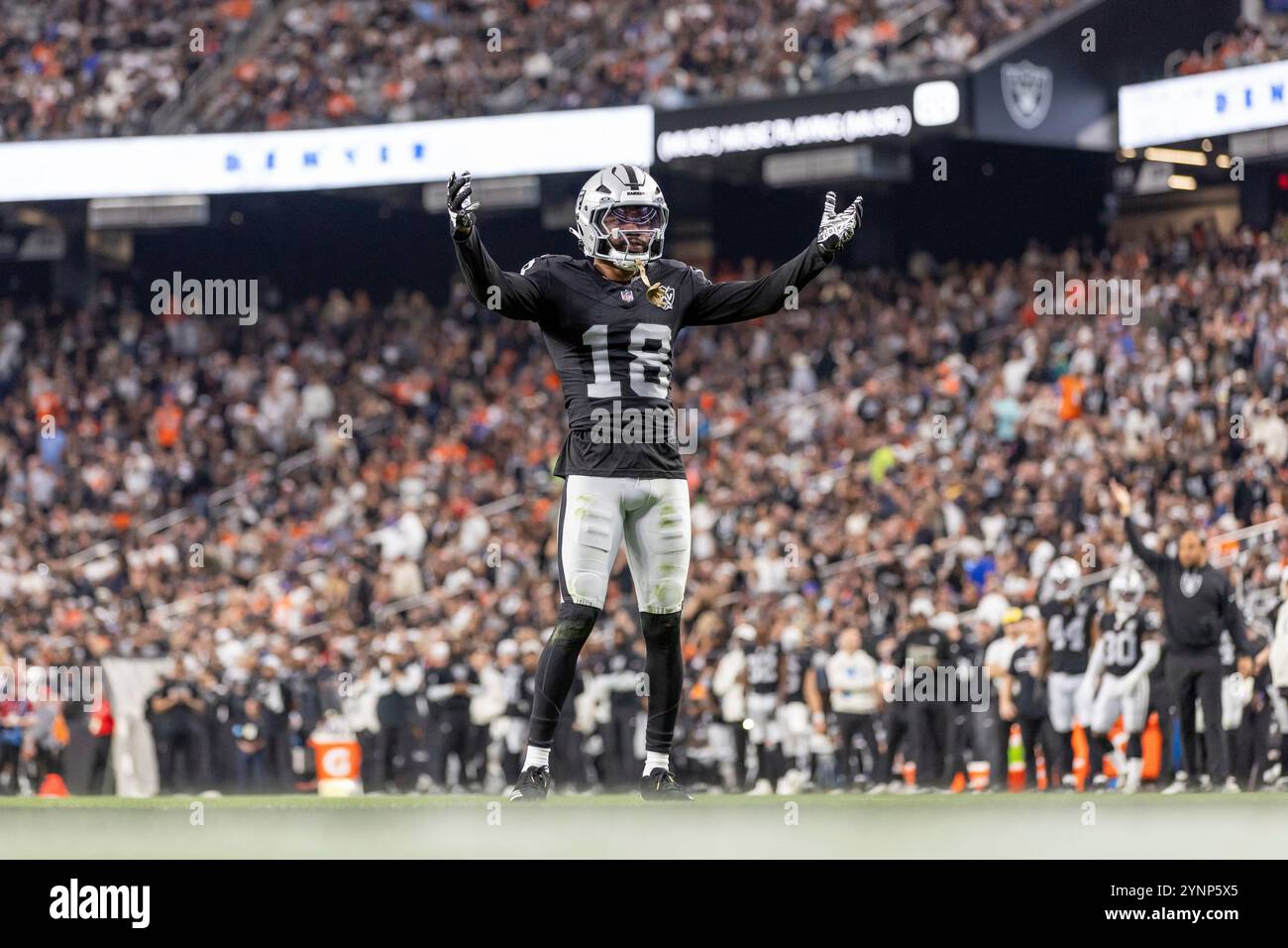 Las Vegas Raiders cornerback Jack Jones (15) pumps up the crowd against ...