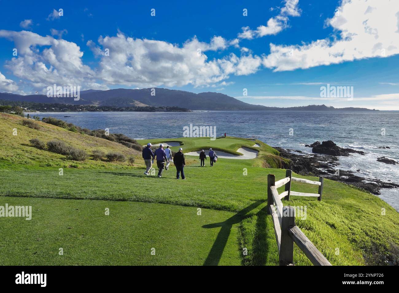 Pebble Beach, Monterey Peninsula, California USA - 2024 Golfers play the famous short par three ...