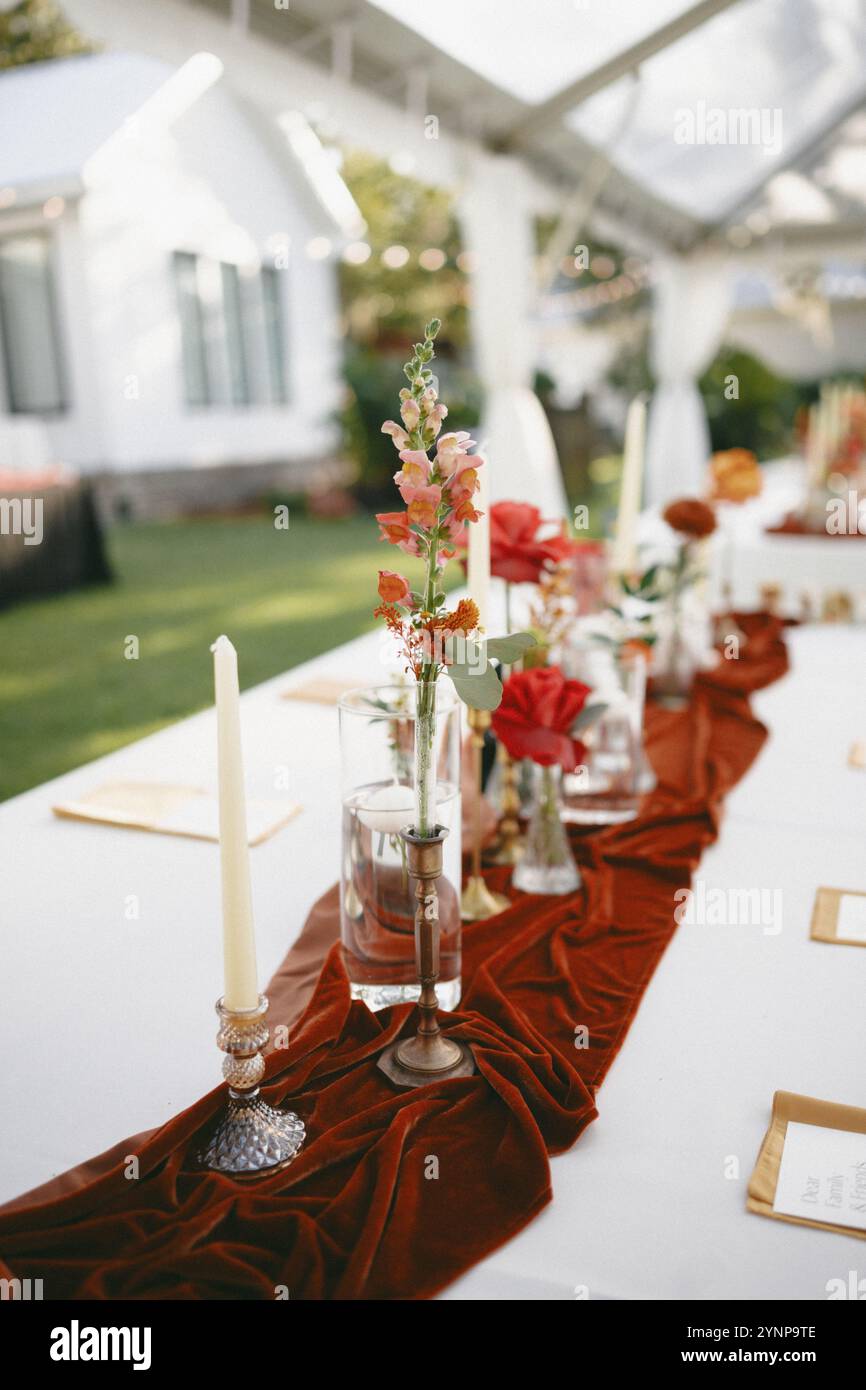 Elegant backyard wedding table decor featuring vibrant fall floral ...