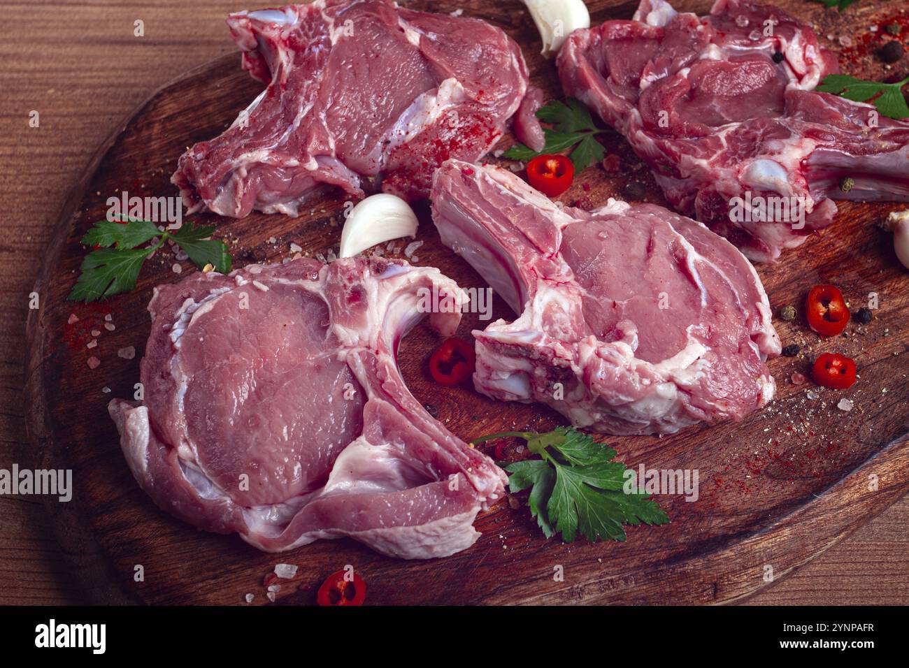 Raw calf meat, meat on the bone, meat for barbecue, cutting board, with ...