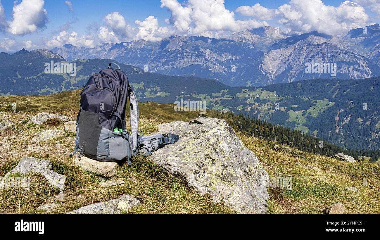 Hiking rucksack in front of a beautiful mountain backdrop Stock Photo ...