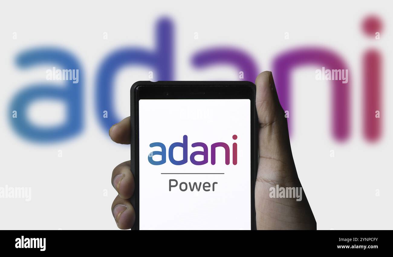 Adani Green Energy Limited on screen in front of business logo Stock ...