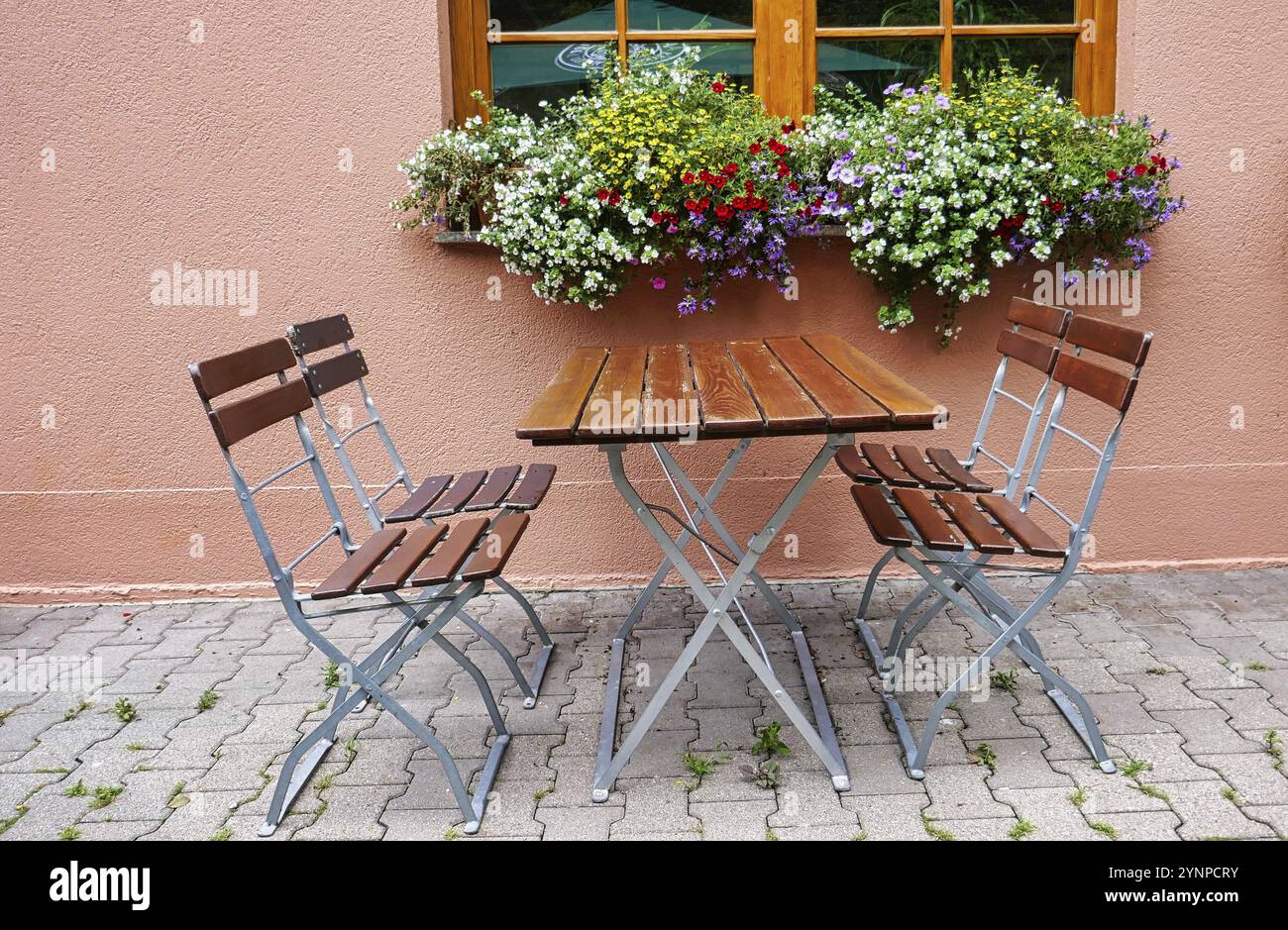 Empty seats in a garden restaurant Stock Photo - Alamy
