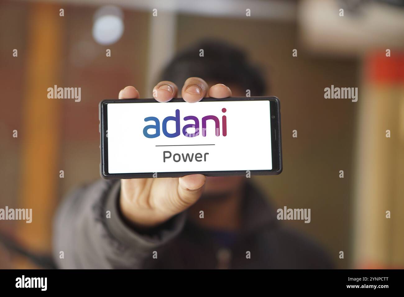 Adani Green Energy Limited on screen in front of business logo Stock ...