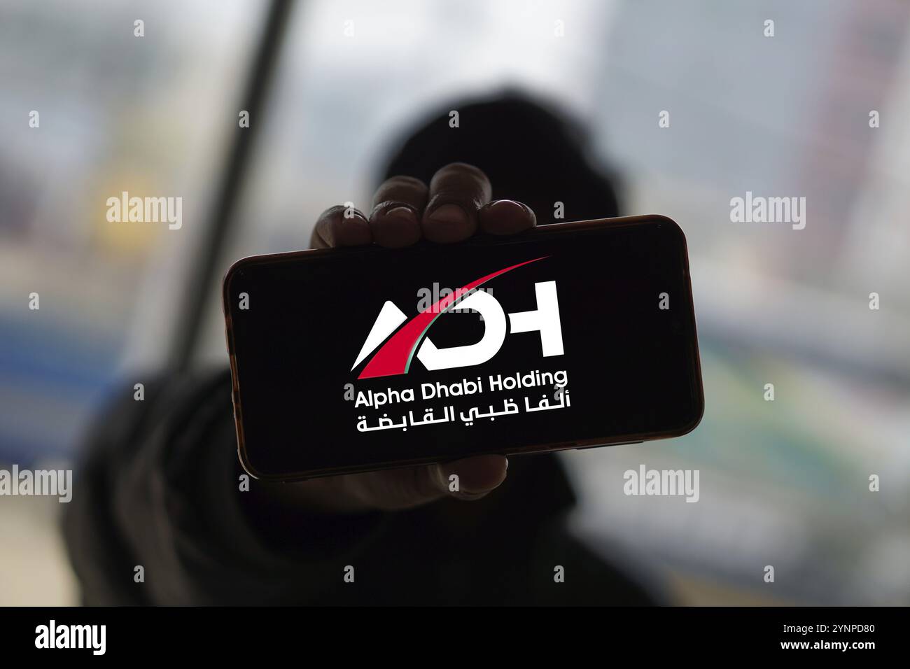 Alpha Dhabi Holding (ADH) logo on smartphone Stock Photo - Alamy