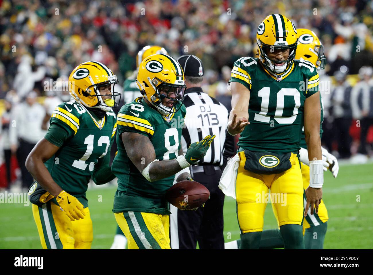 Green Bay Packers running back Josh Jacobs (8) and quarterback Jordan ...