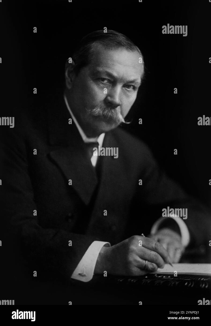 Portrait of a writing Arthur Conan Doyle circa 1920 Stock Photo - Alamy