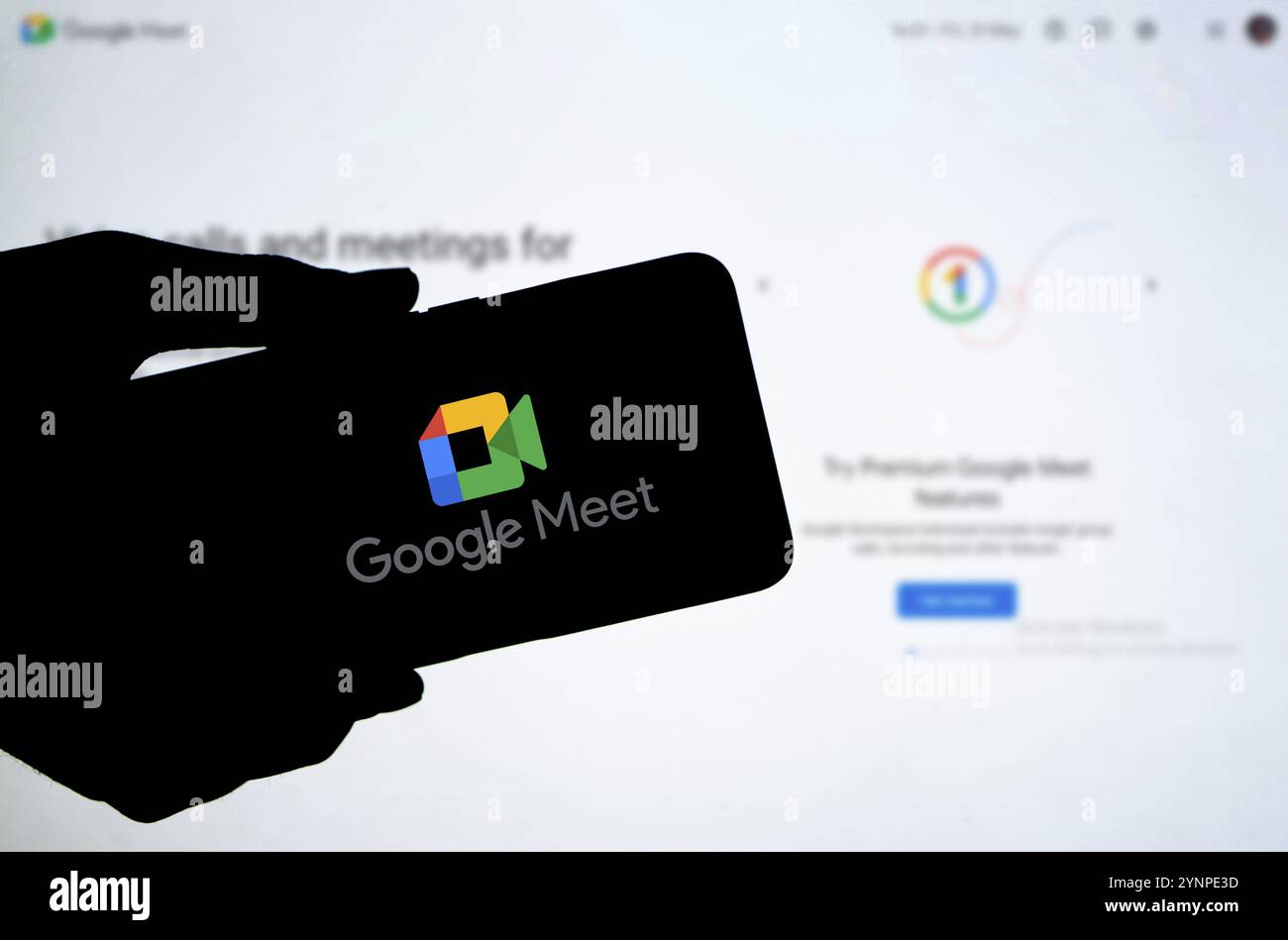 Google Meet app on smartphone screen. On a blue background, Google Meet ...