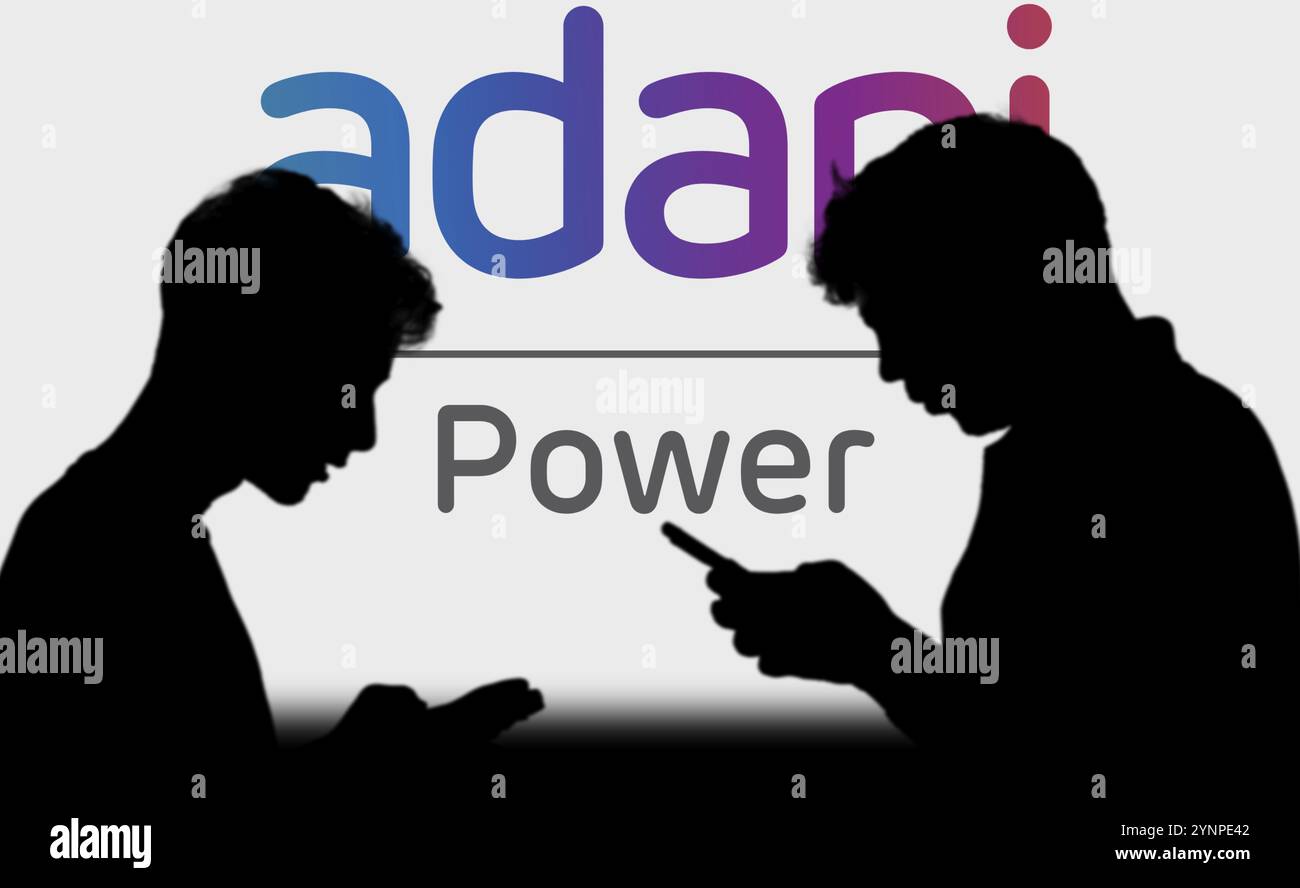 Adani Green Energy Limited on screen in front of business logo Stock ...