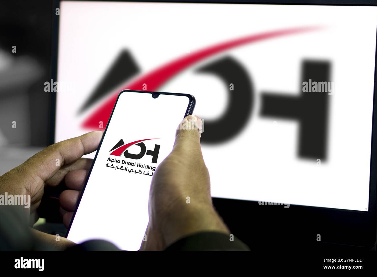 Alpha Dhabi Holding (ADH) logo on smartphone Stock Photo - Alamy