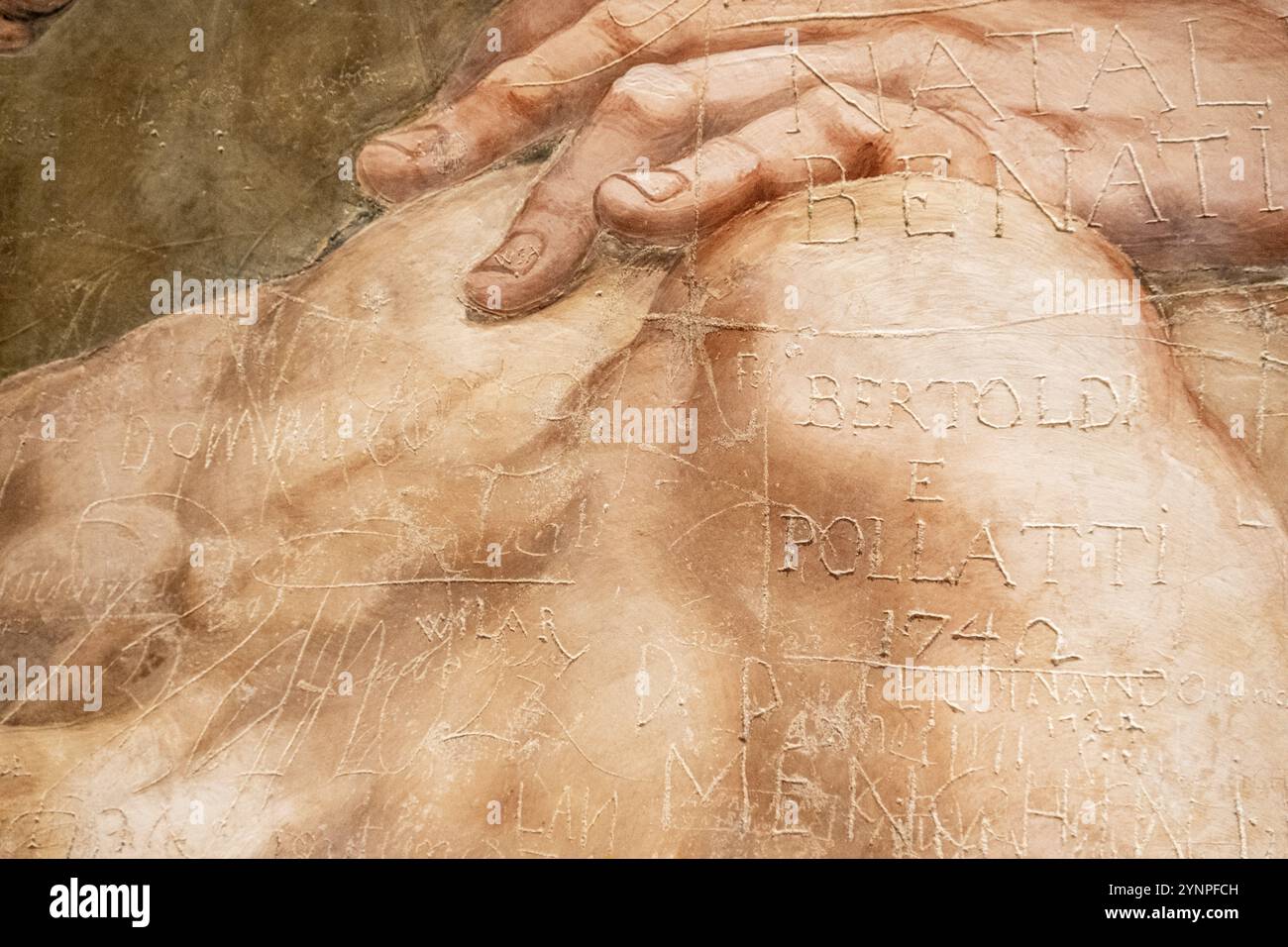 Image of captures the enduring marks of graffiti carved into an ancient ...