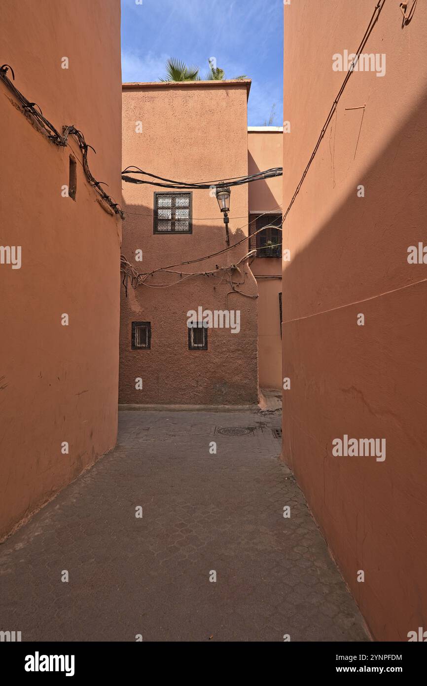 Red colored houses in Marrakesh and an alley, exact location unknown ...