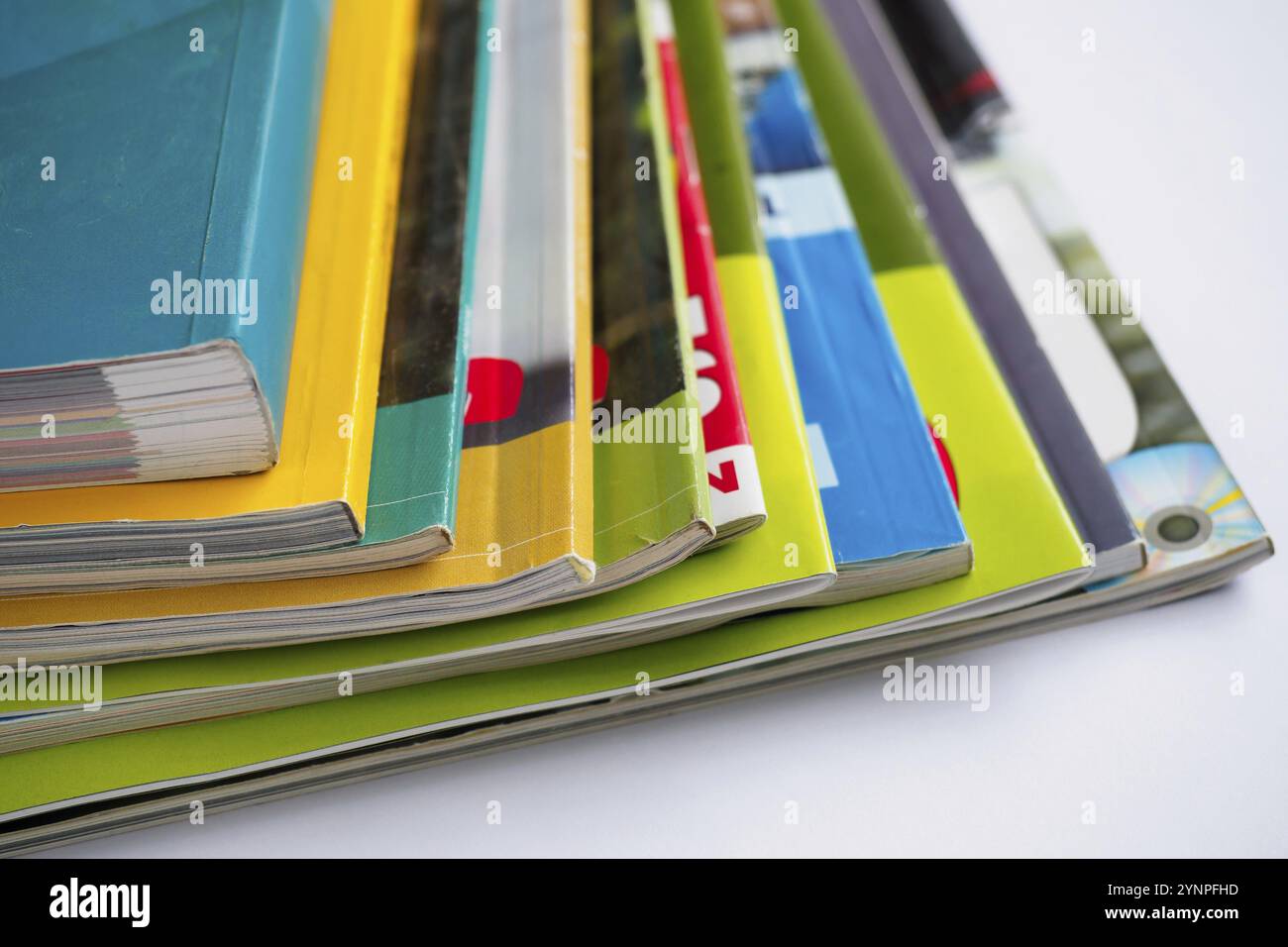 Stack of magazines on white background Stock Photo - Alamy