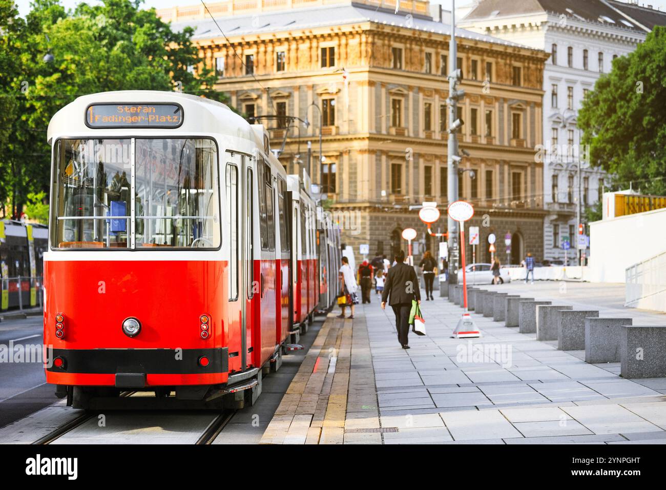 Old fashioned tram goes by the street of Vienna. Vienna is a capital ...
