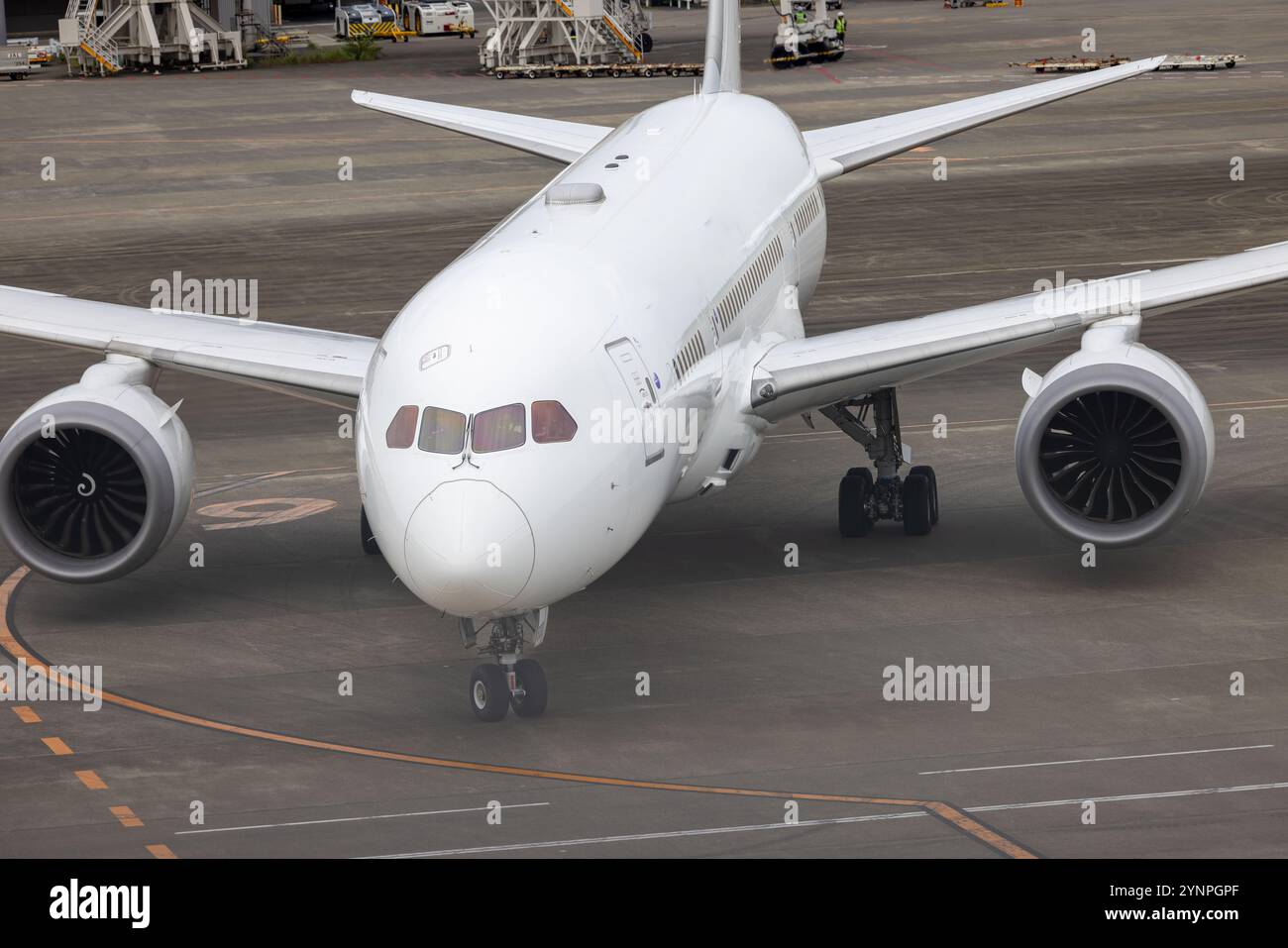 Front view of a modern passenger airplane on the tarmac Stock Photo - Alamy
