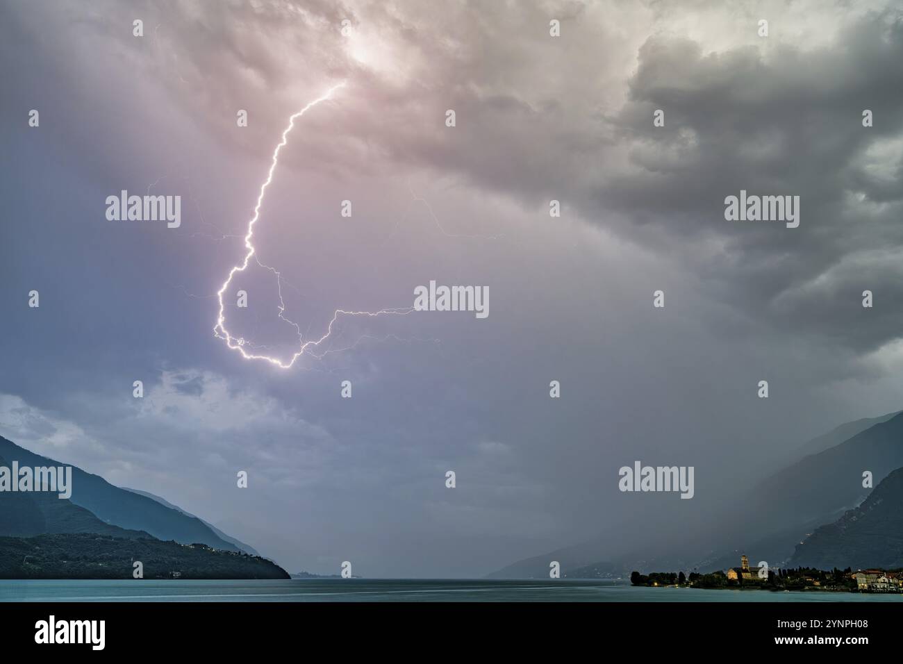 A strong thunderstorm with lots of lightning over Lake Como Stock Photo ...