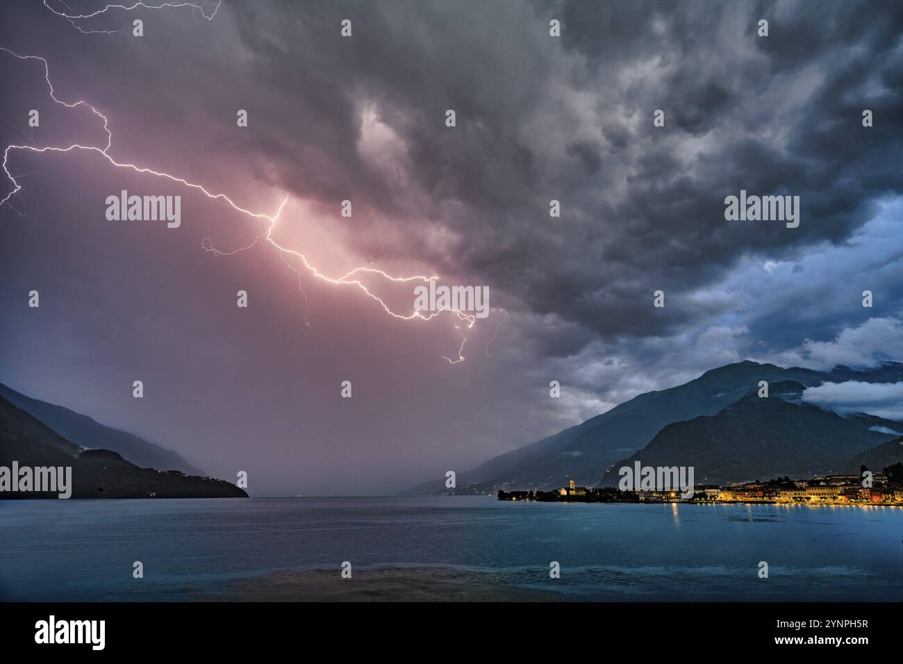 A strong thunderstorm with lots of lightning over Lake Como Stock Photo ...