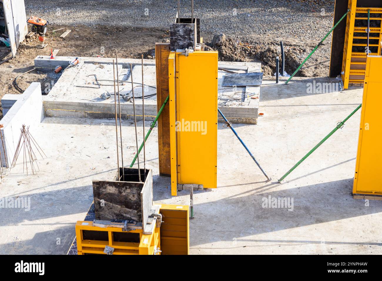 Construction site with concrete formwork and reinforcement rods for ...