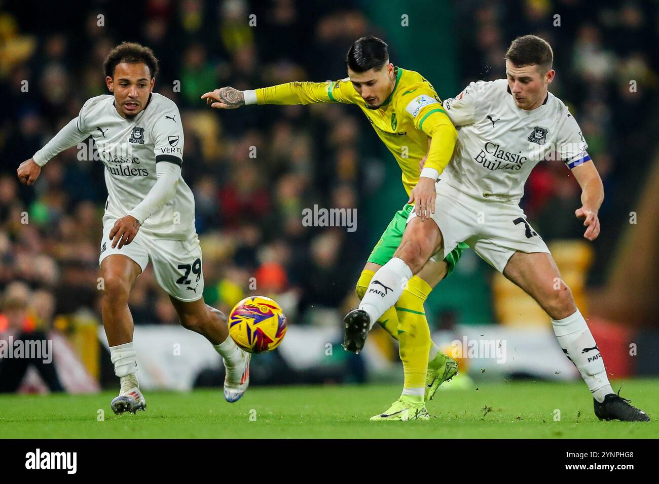 Borja Sainz of Norwich City is put under pressure by Matthew Sorinola ...