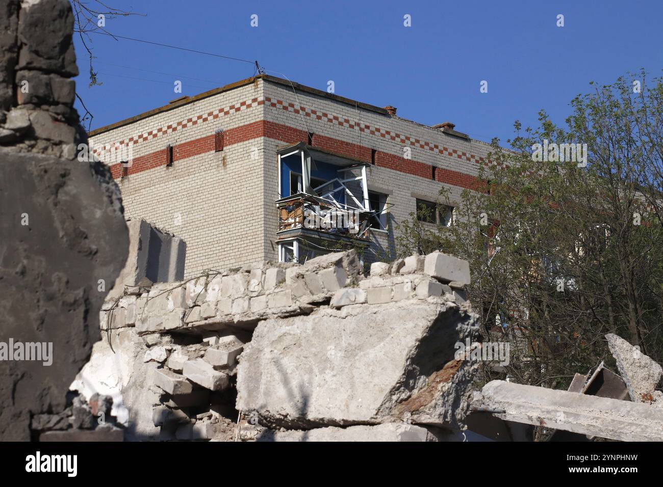 Image of damaged windows, balconies of a destroyed residential building ...
