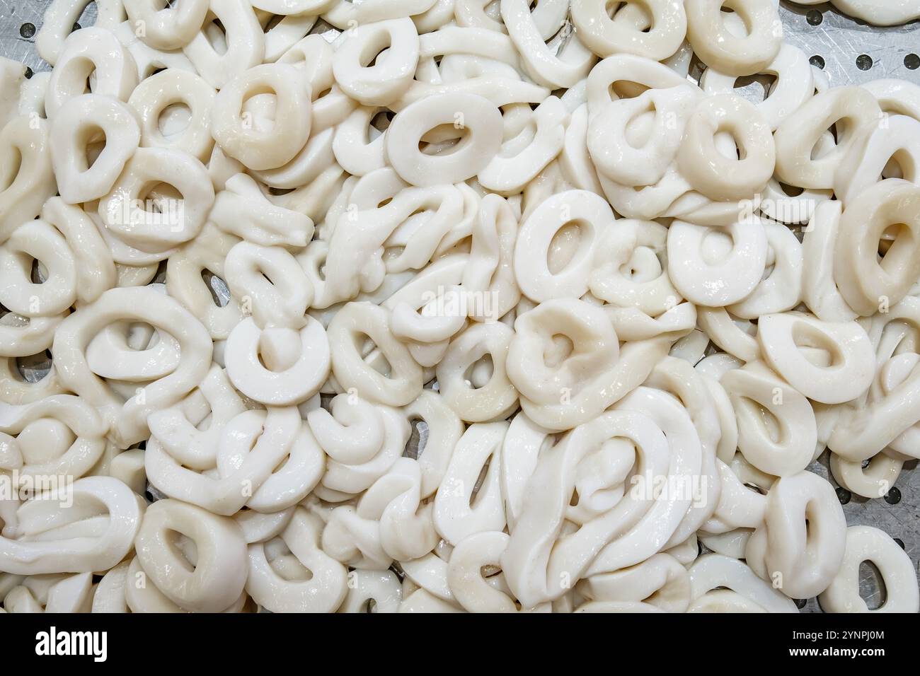 fresh raw sliced squid rings on supermarket counter Stock Photo - Alamy