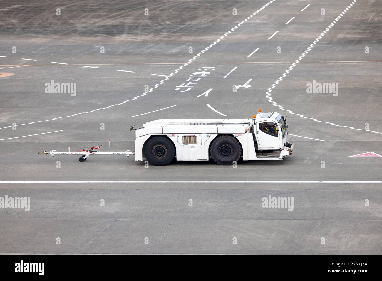 Airport aircraft towing vehicle on the tarmac Stock Photo - Alamy