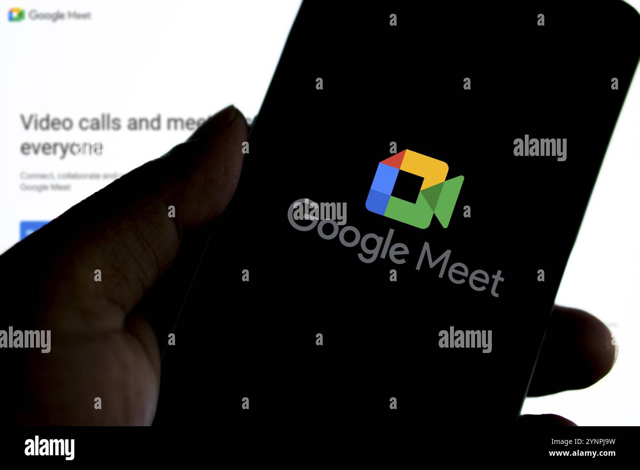 Google Meet app on smartphone screen. On a blue background, Google Meet ...