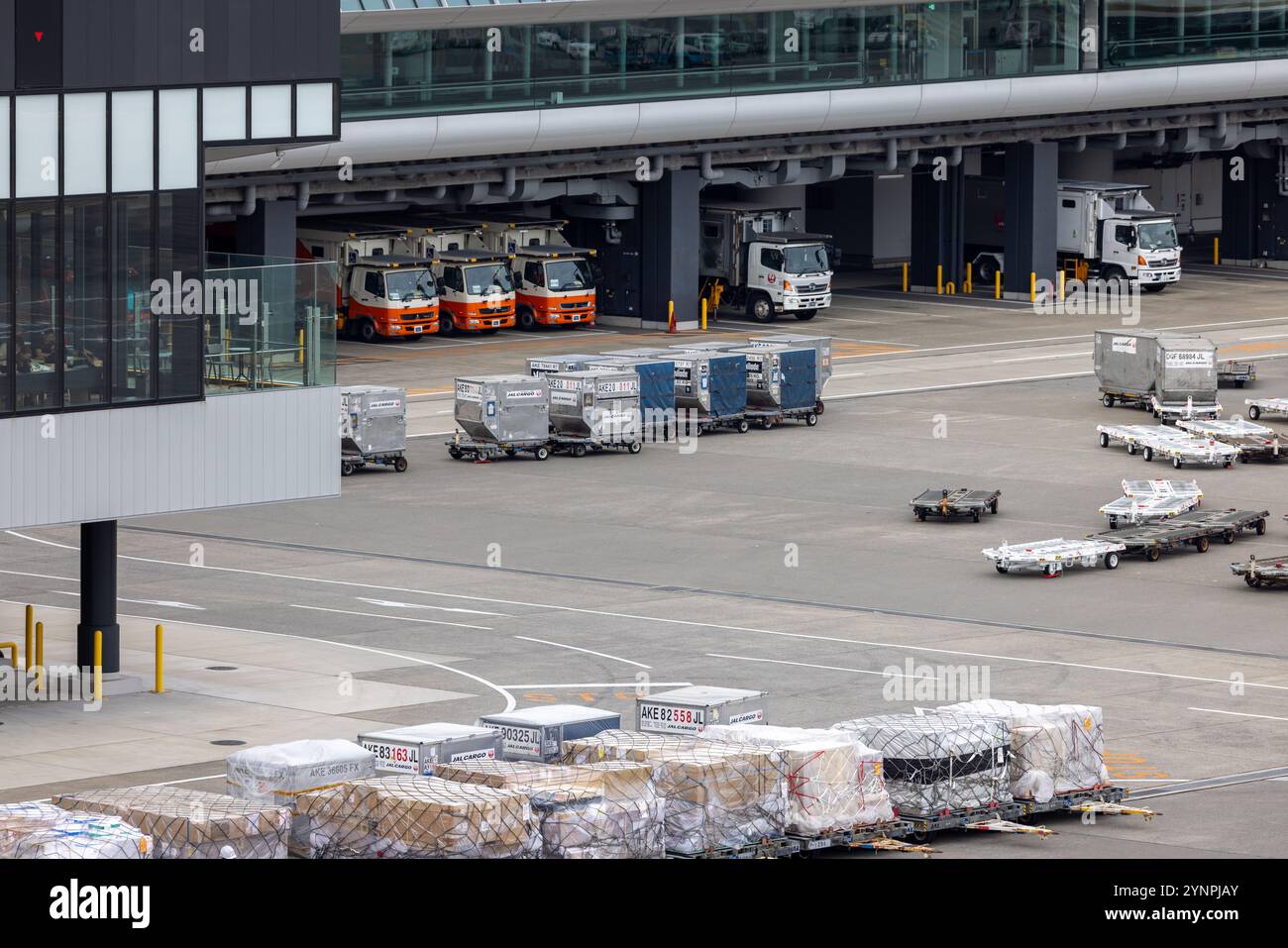 Airport cargo area with ground vehicles and freight containers Stock ...