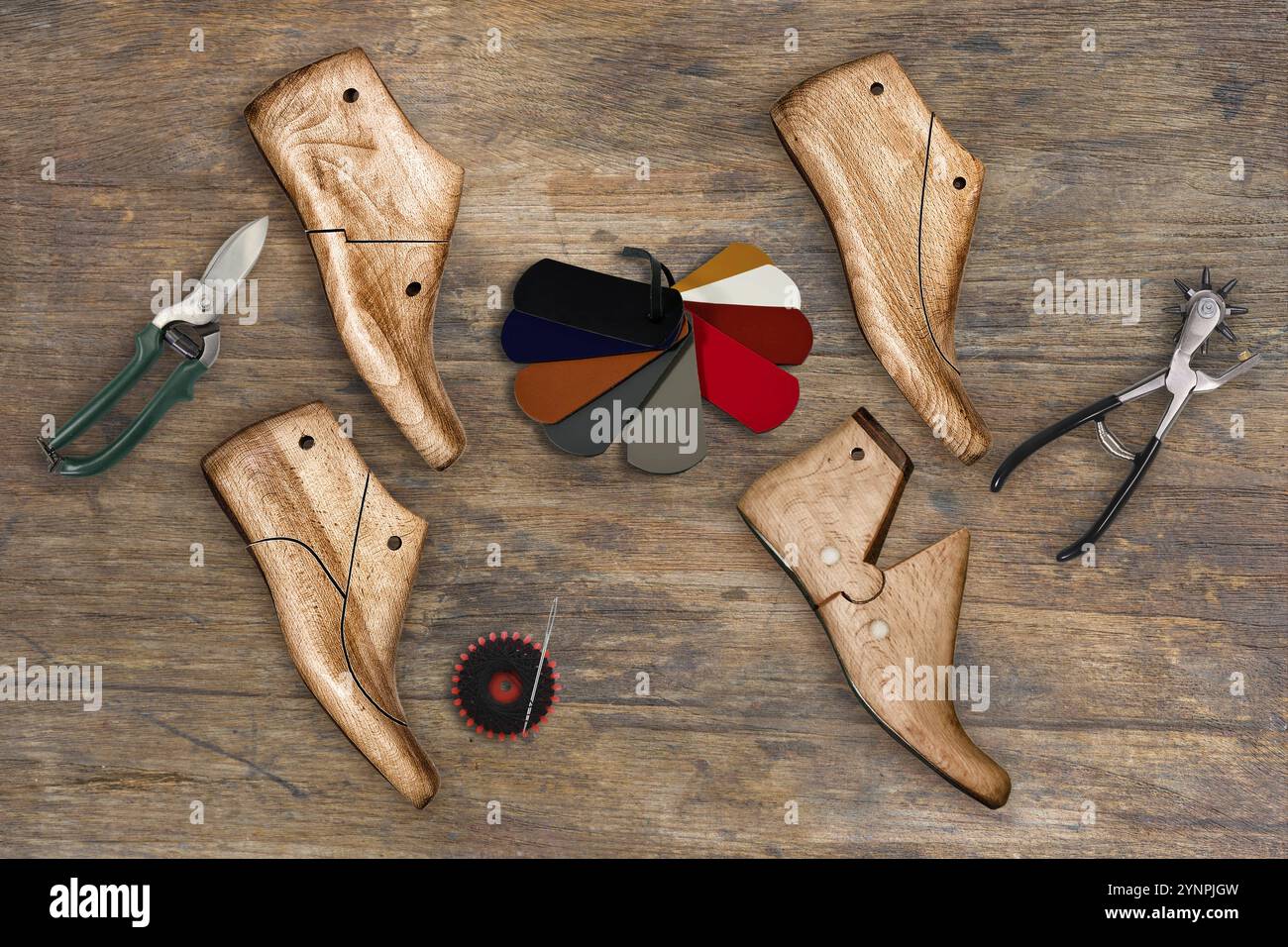 Shoe lasts and shoemaking tools on a workbench Stock Photo - Alamy