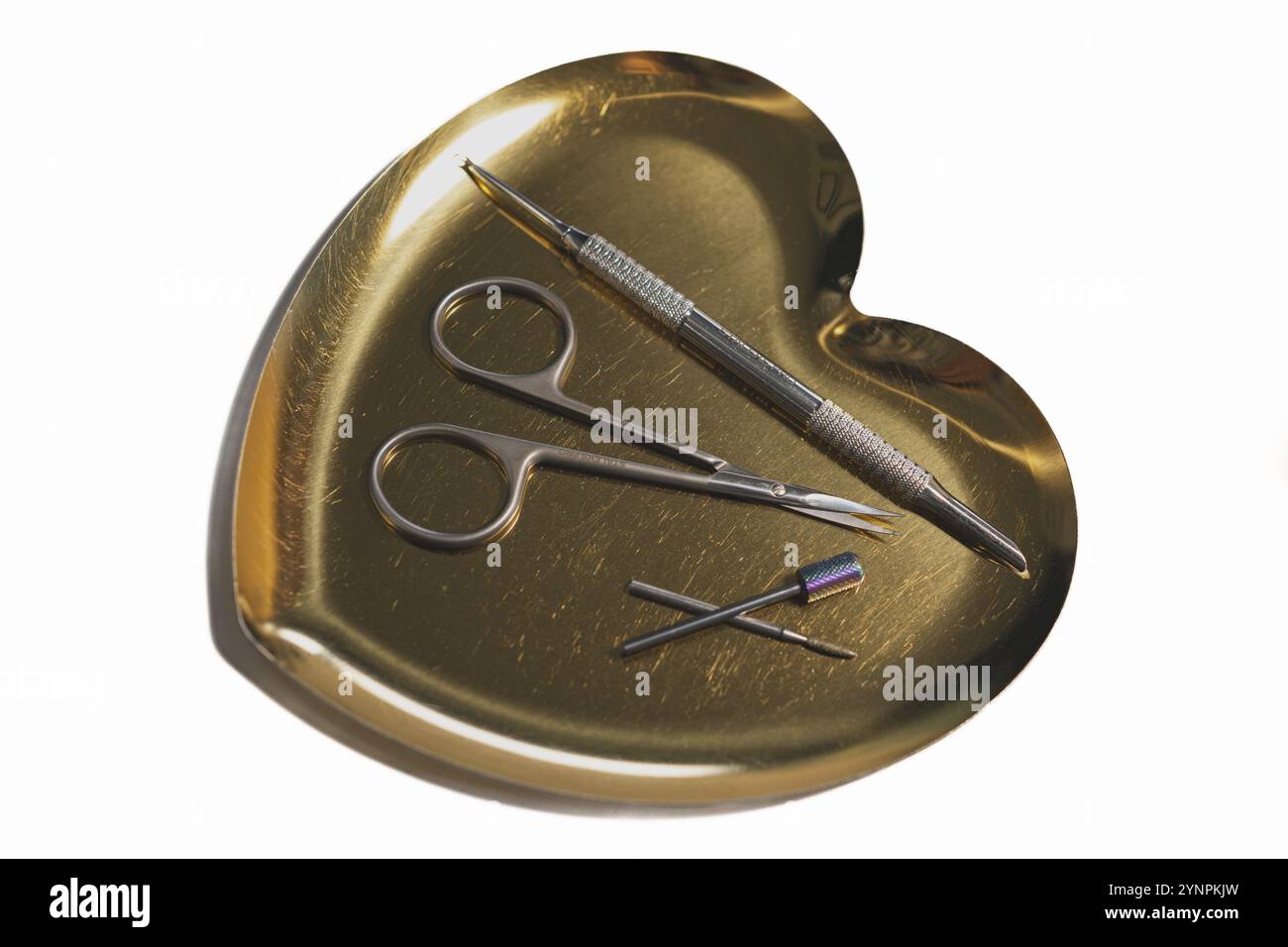 Tools for making nails in beauty parlor, scissors, cutter on a gold ...