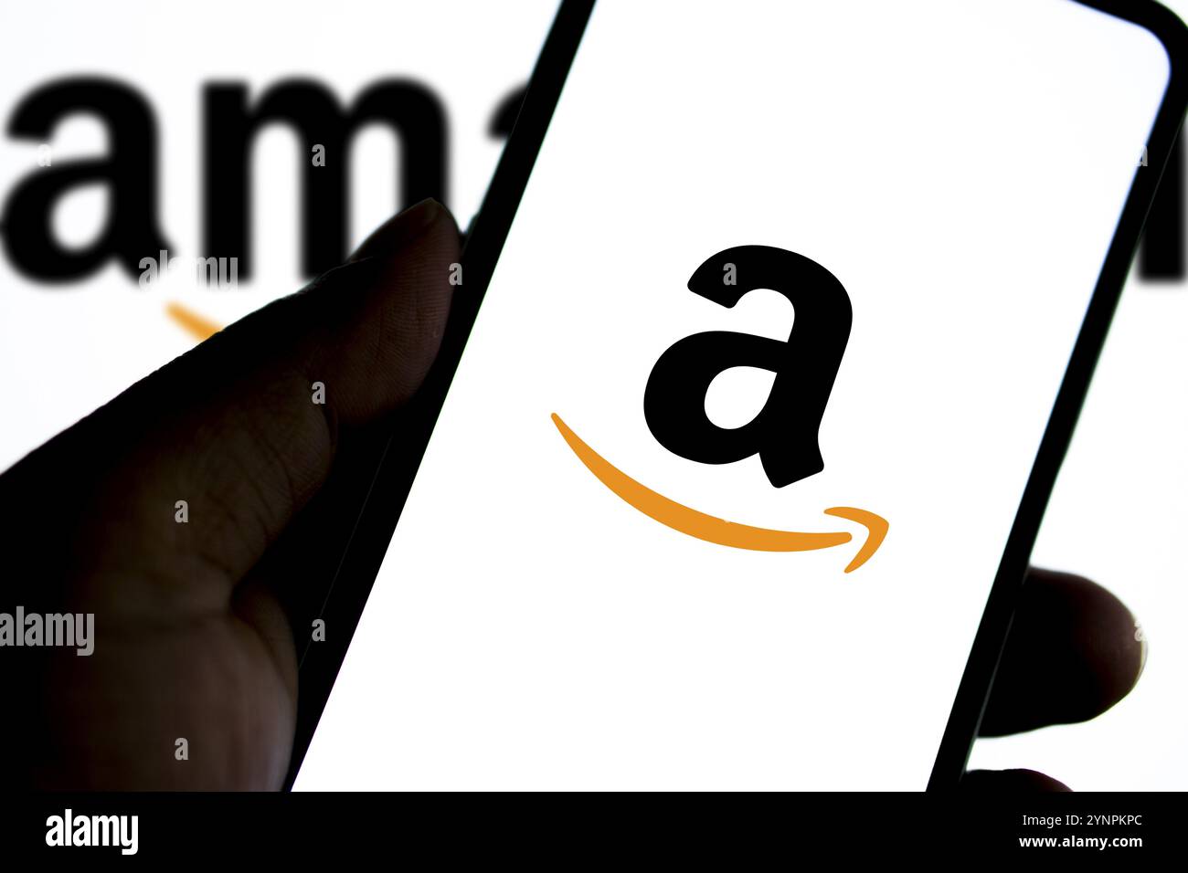 Amazon logo seen displayed on a smartphone Stock Photo - Alamy