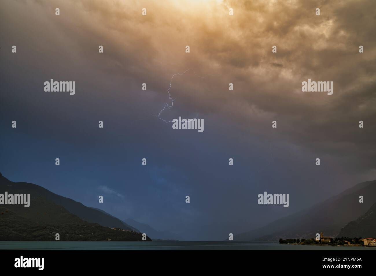 A strong thunderstorm with lots of lightning over Lake Como Stock Photo ...
