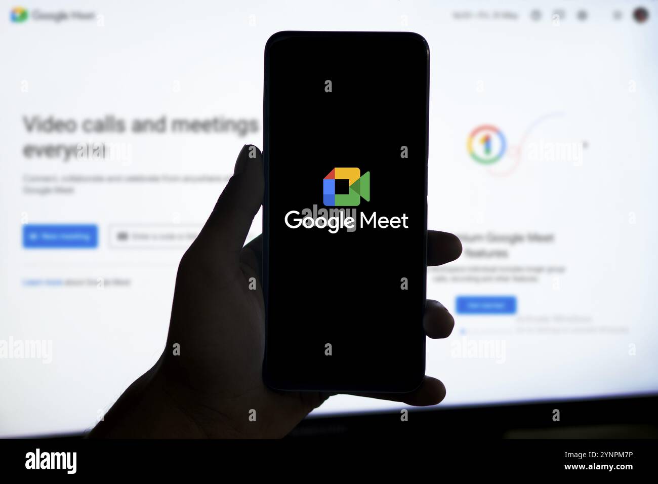 Google Meet app on smartphone screen. On a blue background, Google Meet ...