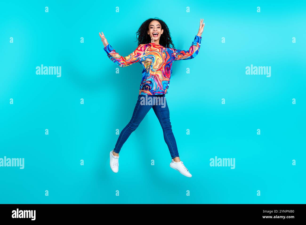 Full size photo of pretty young girl jump rejoice isolated on teal ...