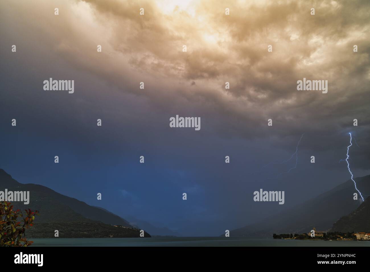 A strong thunderstorm with lots of lightning over Lake Como Stock Photo ...