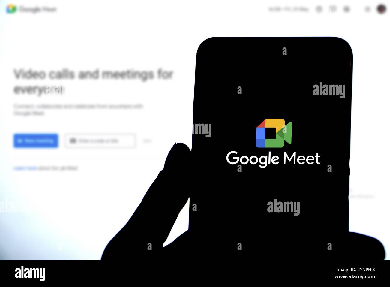 Google Meet app on smartphone screen. On a blue background, Google Meet ...
