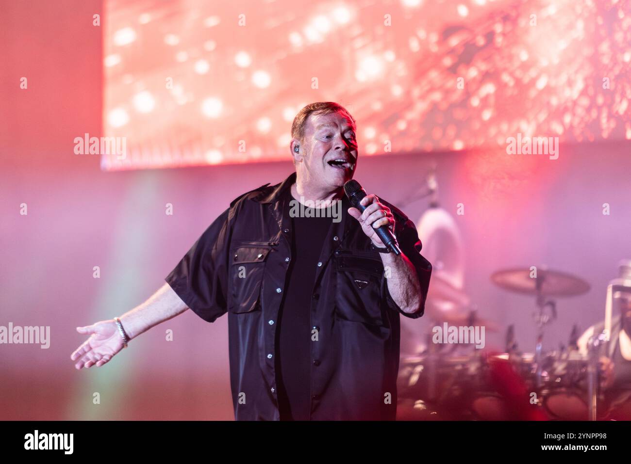 Ali Campbell, performing as UB40 featuring Ali & Astro, singing on ...