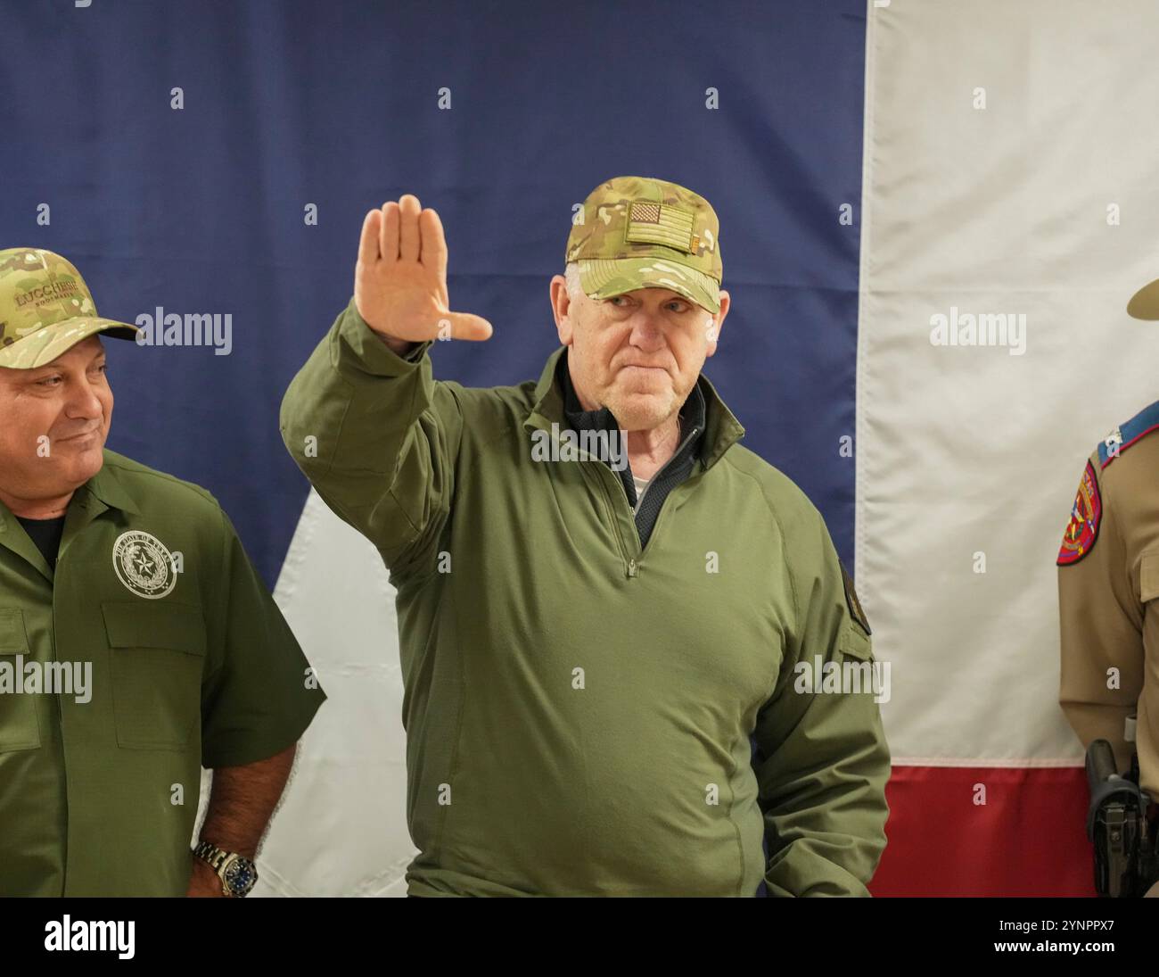 Newly appointed "border czar" TOM HOMAN waves to the assembled National ...