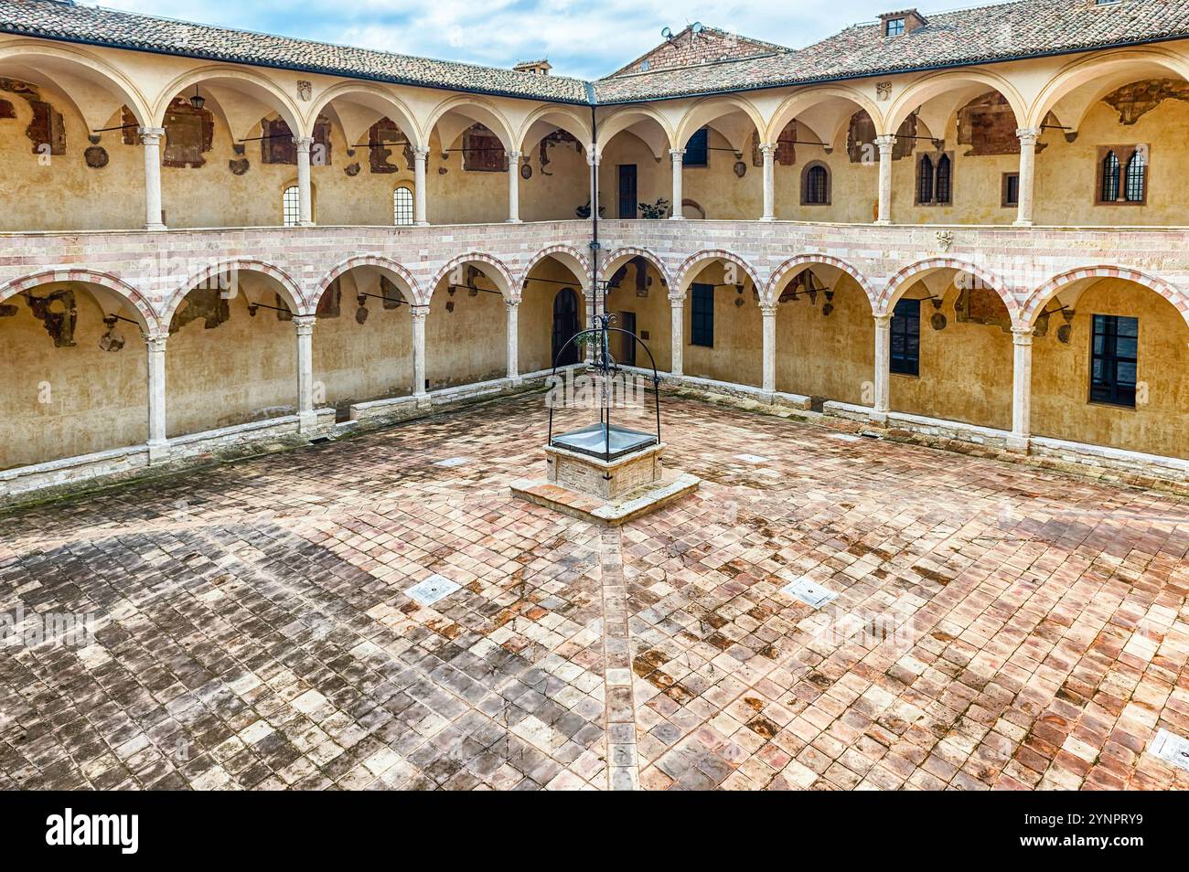 The scenic courtyard in the friary of the Basilica of Saint Francis, Assisi, Italy Stock Photo ...
